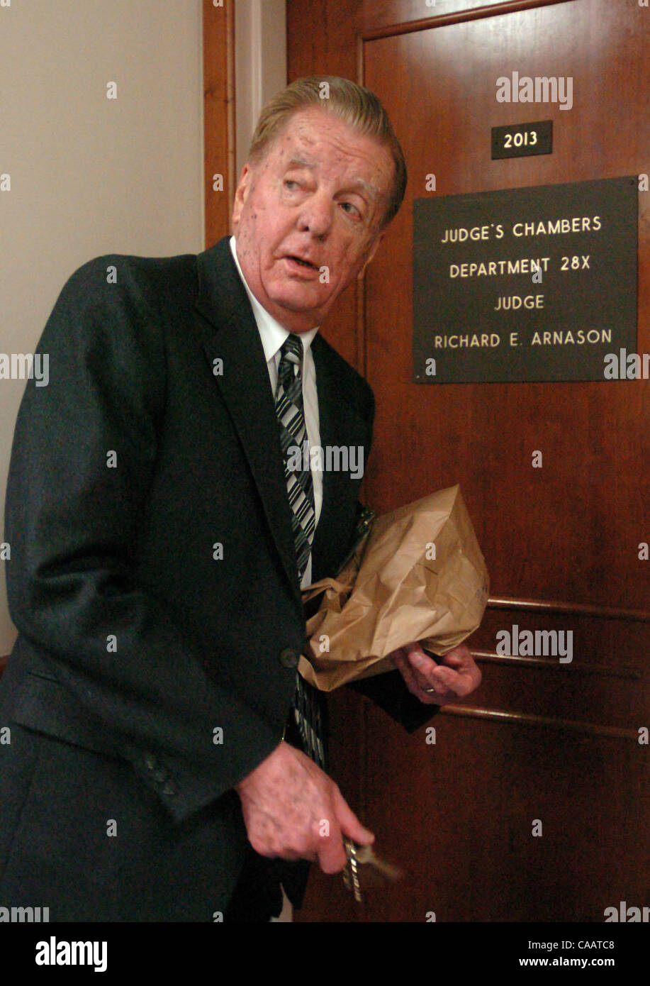 Judge Richard Arnason returns to his chambers Jan. 21, 2004, in the ...