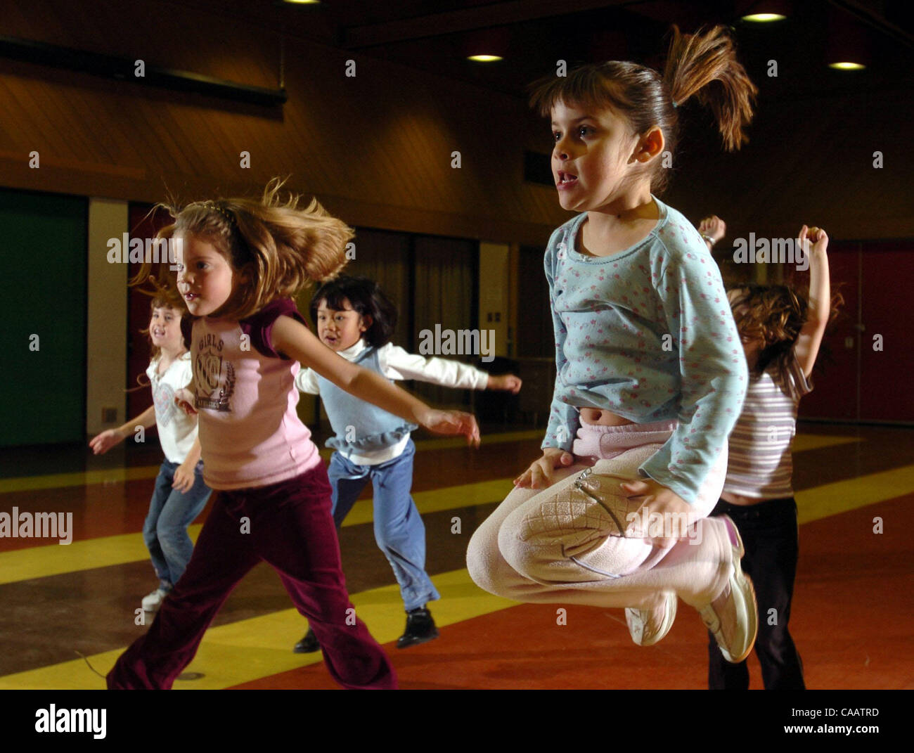 Leeana Valerio cq (right) practices leaping during her cheerleading ...