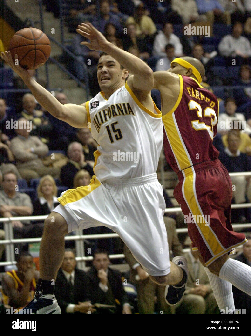 Cal's Richard Midgley, goes for a layup past USC's Desmon Farmer in ...