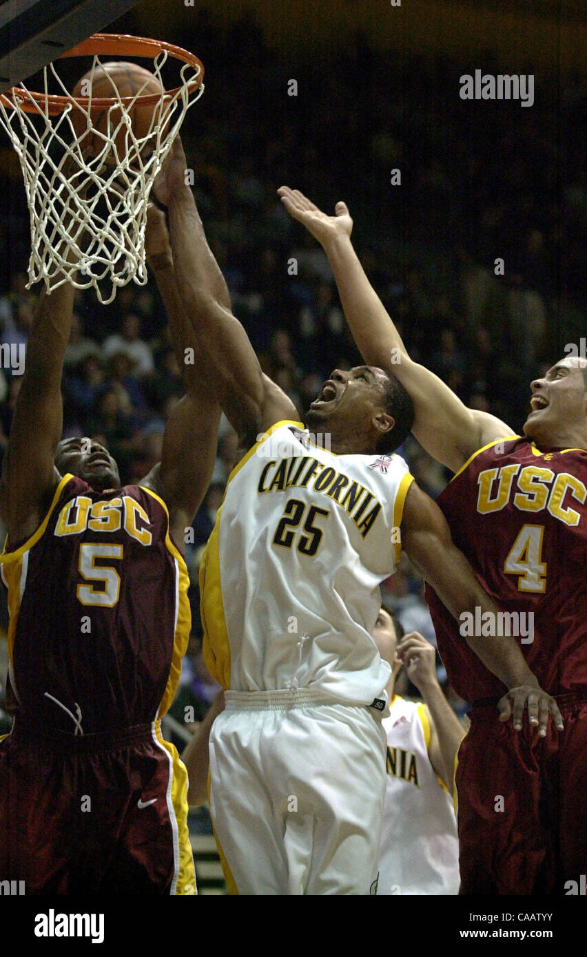 Cal's Marquise Kately, splits the defense of USC's Jeff McMillan, left ...