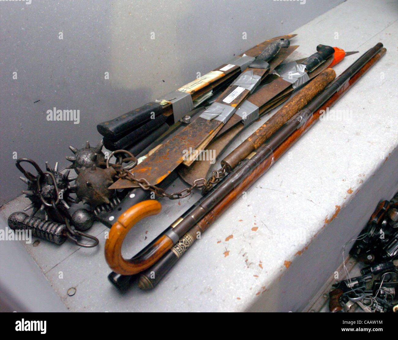 These maces, a sword canes, and assorted machetes will be smelted down ...