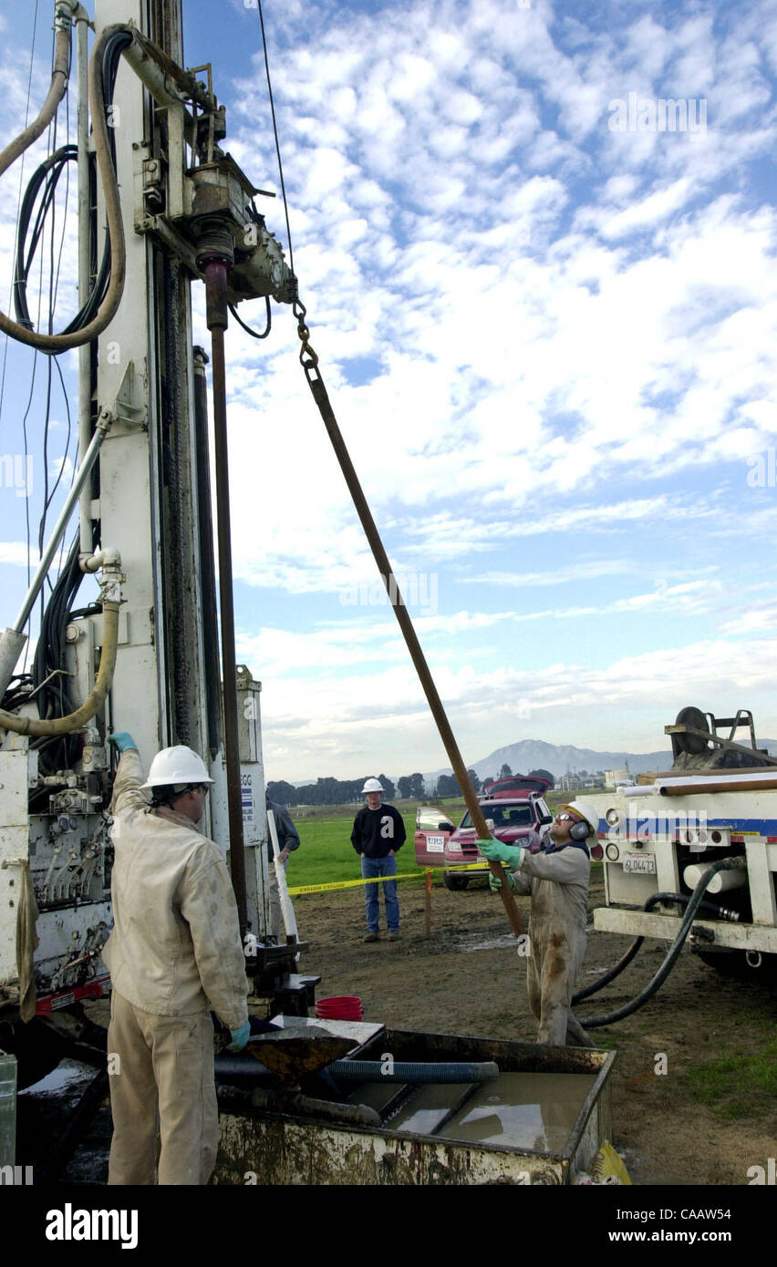 Drillers Chris St. Pierre, left, and Angel Salazar, right, drill wells ...