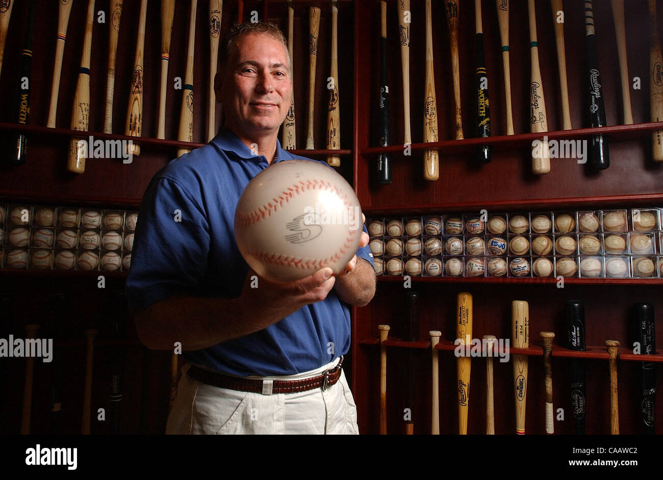 Former Major League Baseball pitcher Tom Candiotti, age 47, holds a bowling bowl at his home on ...