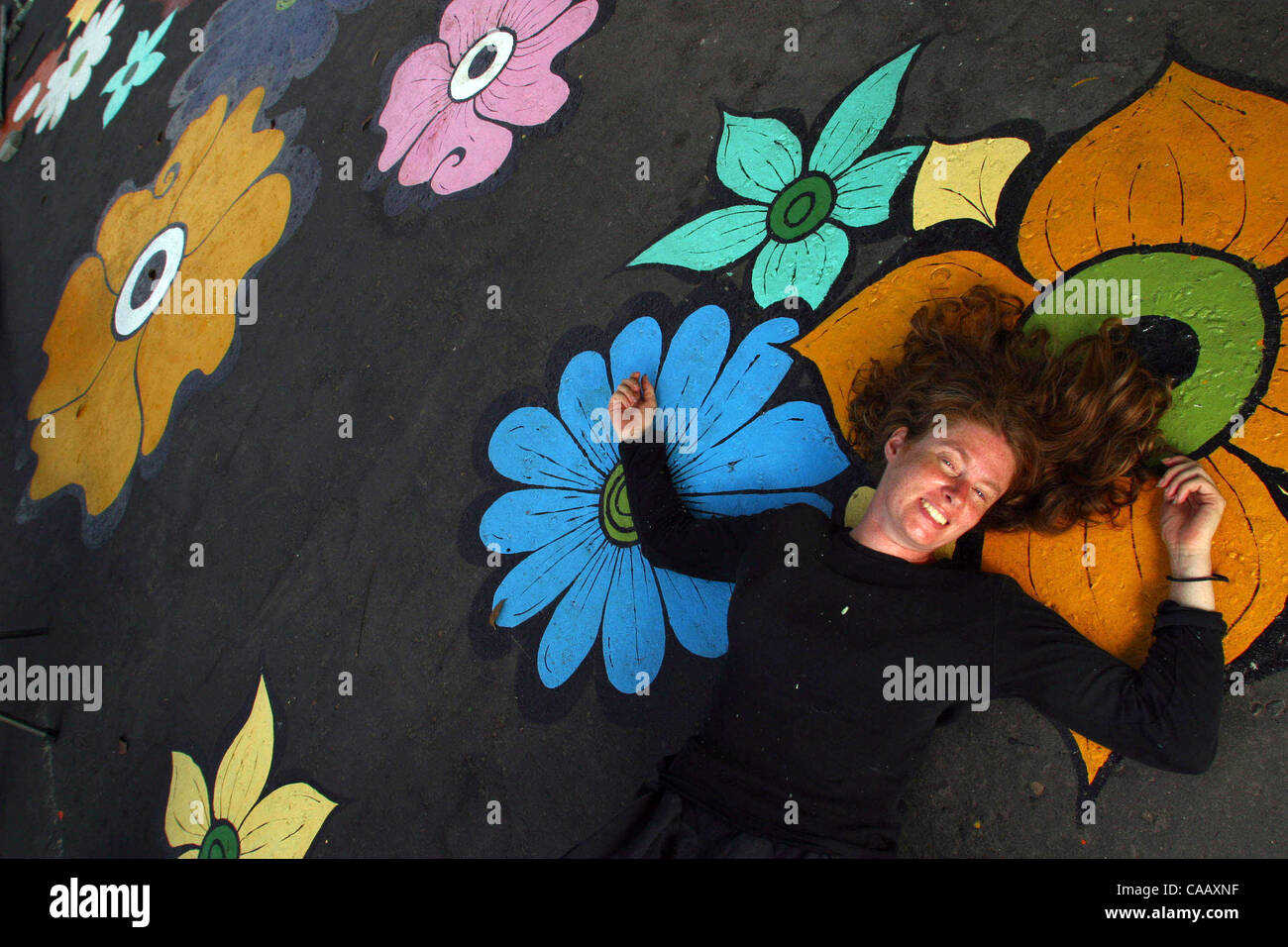 YOGYAKARTA, INDONESIA JULY 24, 2003 Megan Wilson lies on her self ...