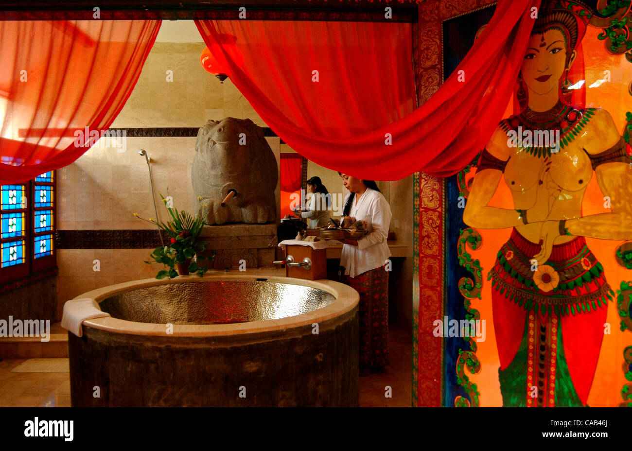 MALANG, EAST JAVA, INDONESIA An hotel woman staff prepares spa ...