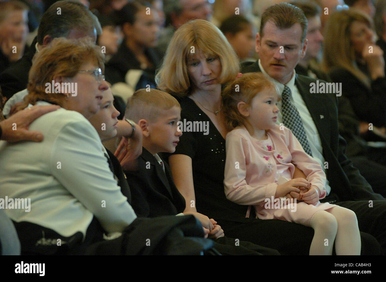 Christine Smiley, center, comforts her children during a funeral ...