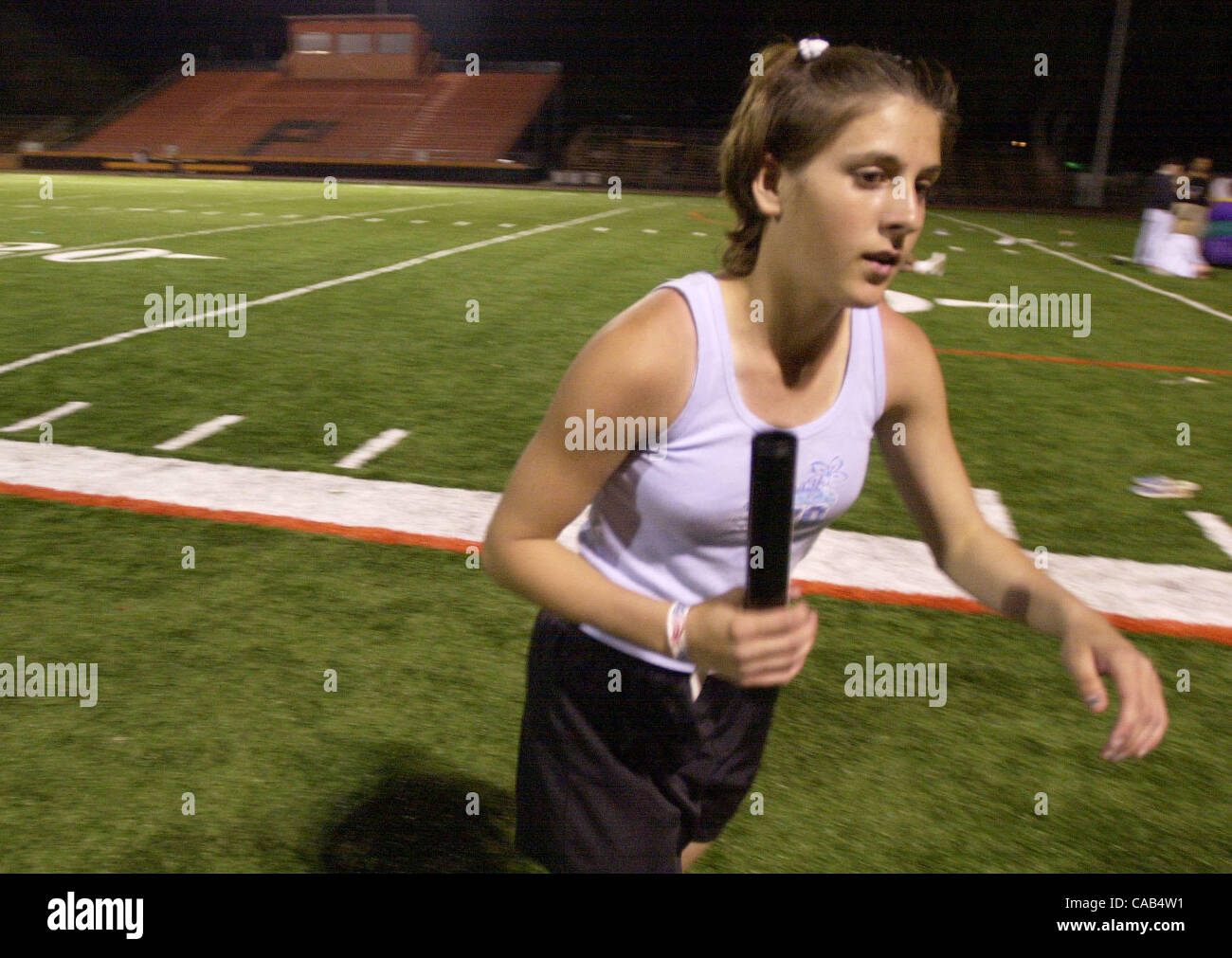 Pittsburg High School 11th grader Sam Bagh, left, hands off the baton ...
