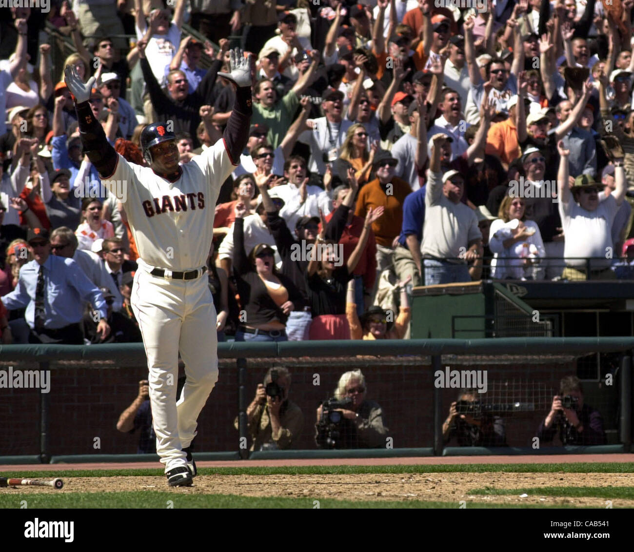 Barry Bonds is greeted at homeplate after hitting his 660th career home ...
