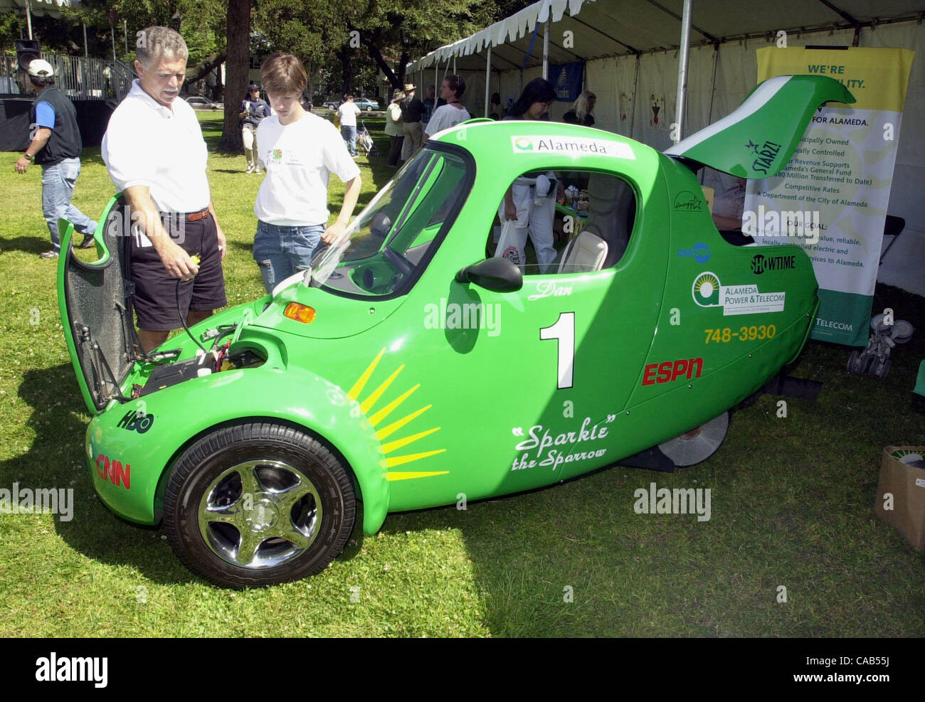 Tom Montoya of Alameda Power & Telecom shows a three-wheeled electric ...