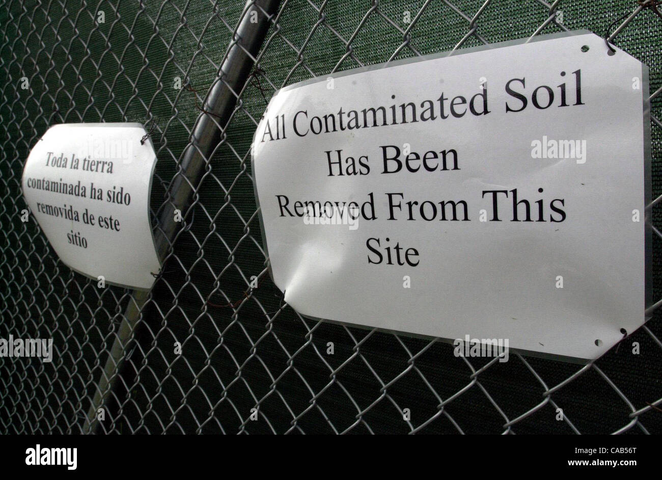 A sign posted in english and spanish informing the public that tainted ...