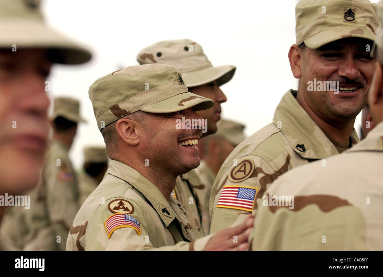 metro- Hector Negron, center, celebrates with his unit after they are ...