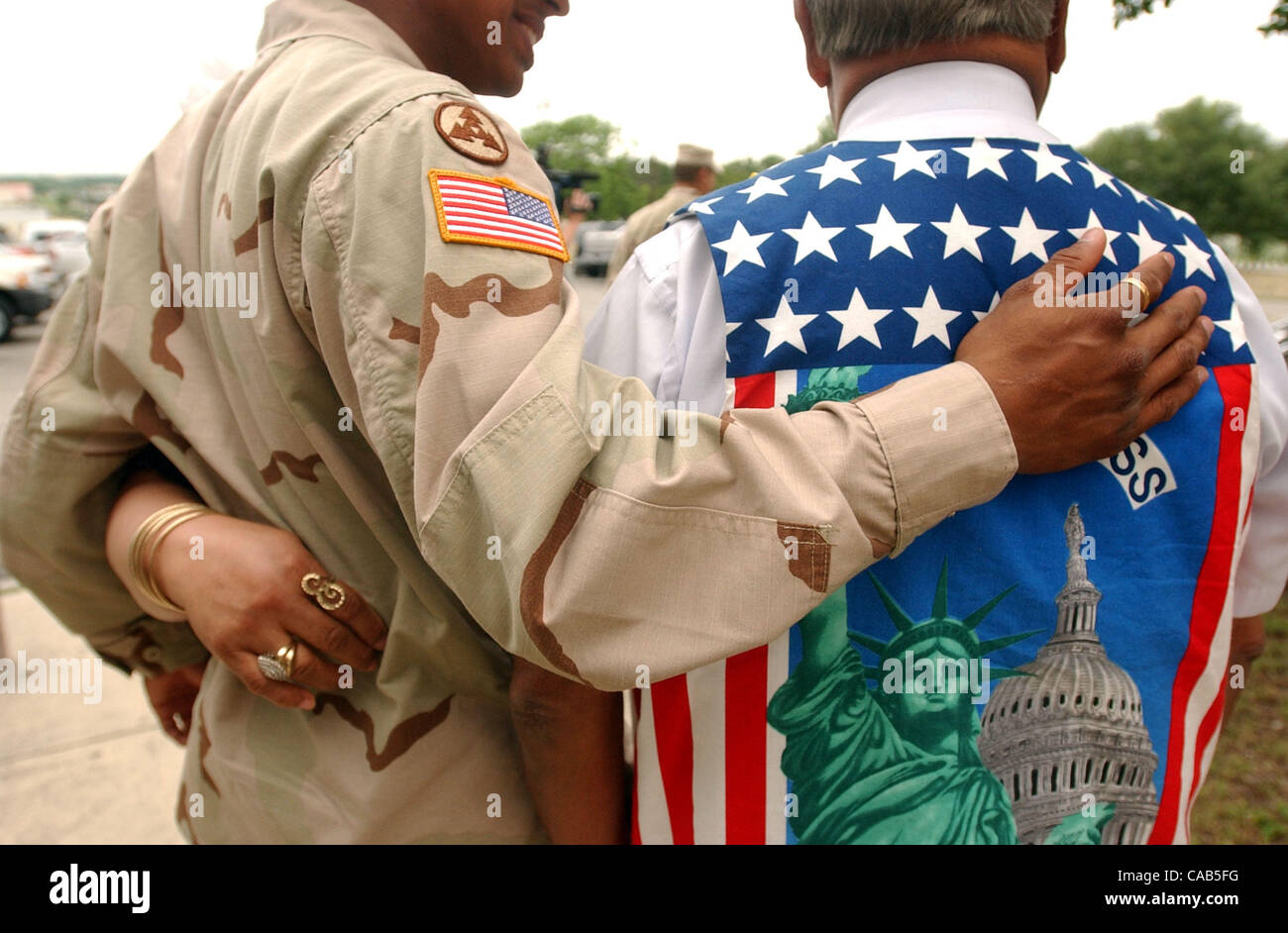 metro-Sgt Eric Antu greets his parents, Juan Antu, right, and Maria ...