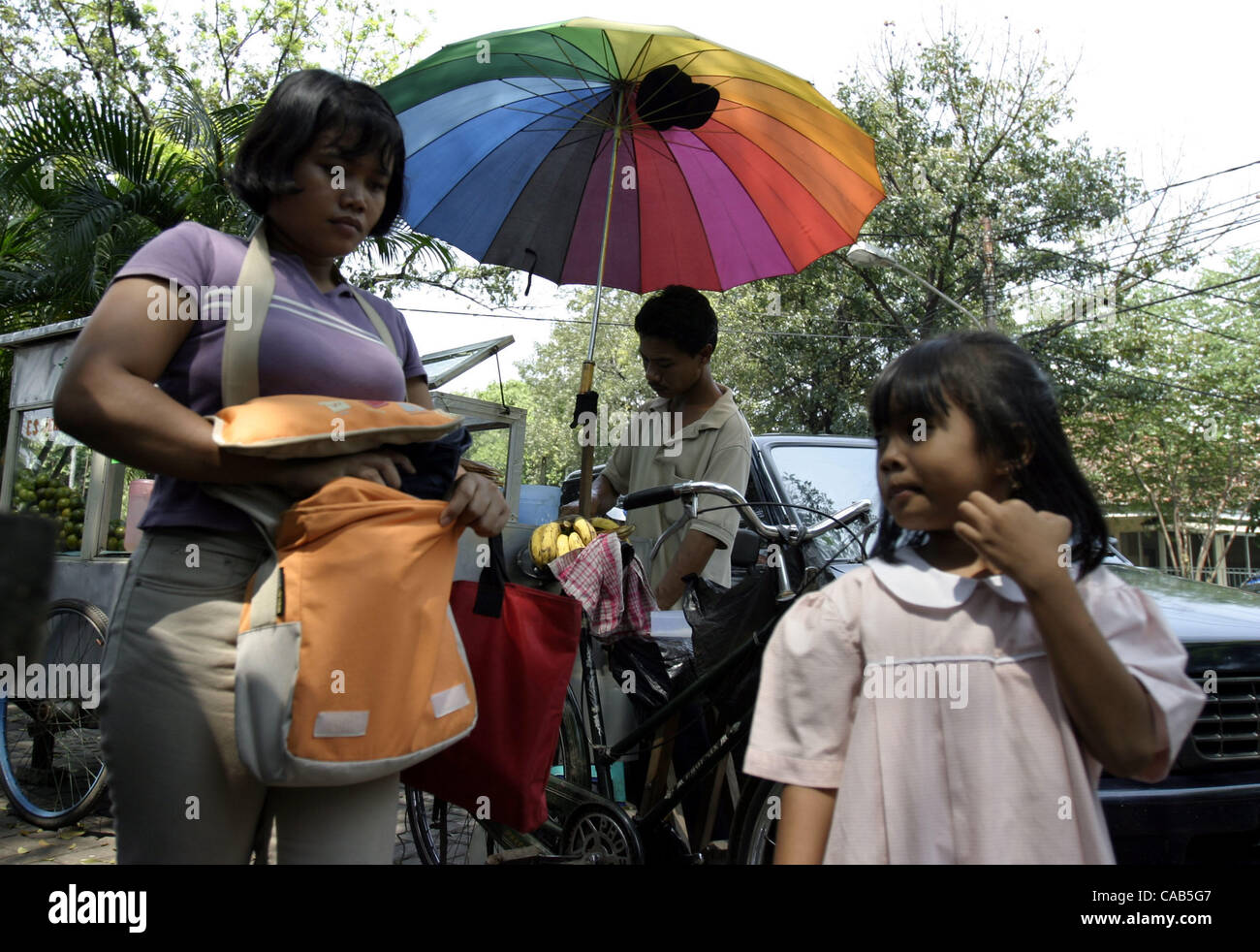 APRIL 28, 2004 JAKARTA, INDONESIA Children go home after school. Many ...