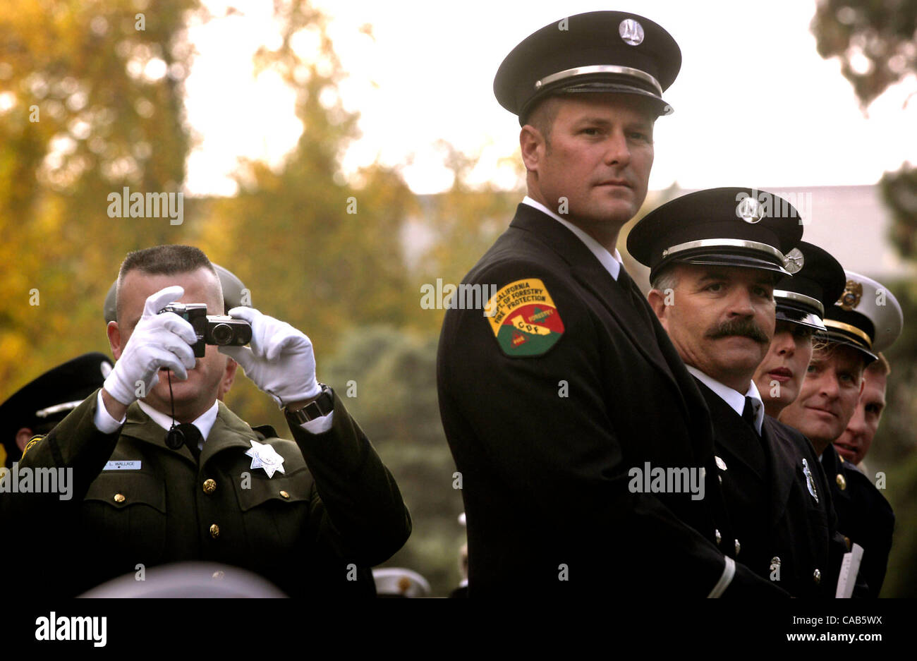San Diego Sheriff Deputy Emory Wallace, left, stood next to other fire ...