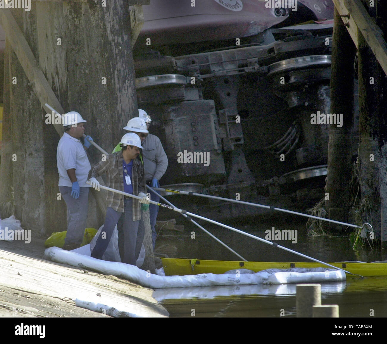 Clean up crew with an environmental agency clean up the diesel, spilled ...