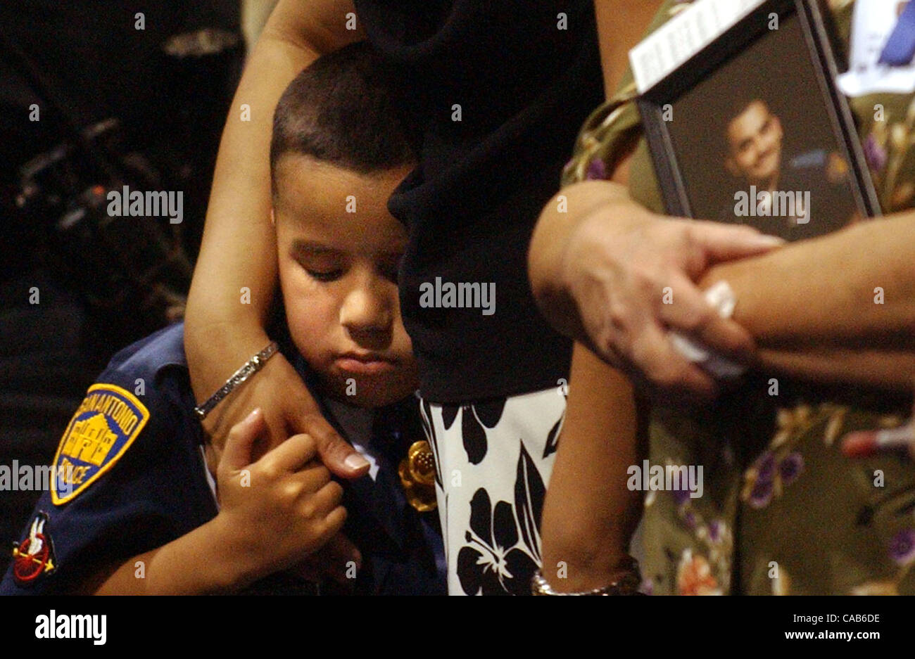 Metro-Jeremy Morales, 5, holds the hand of his mother, Rena Morales ...