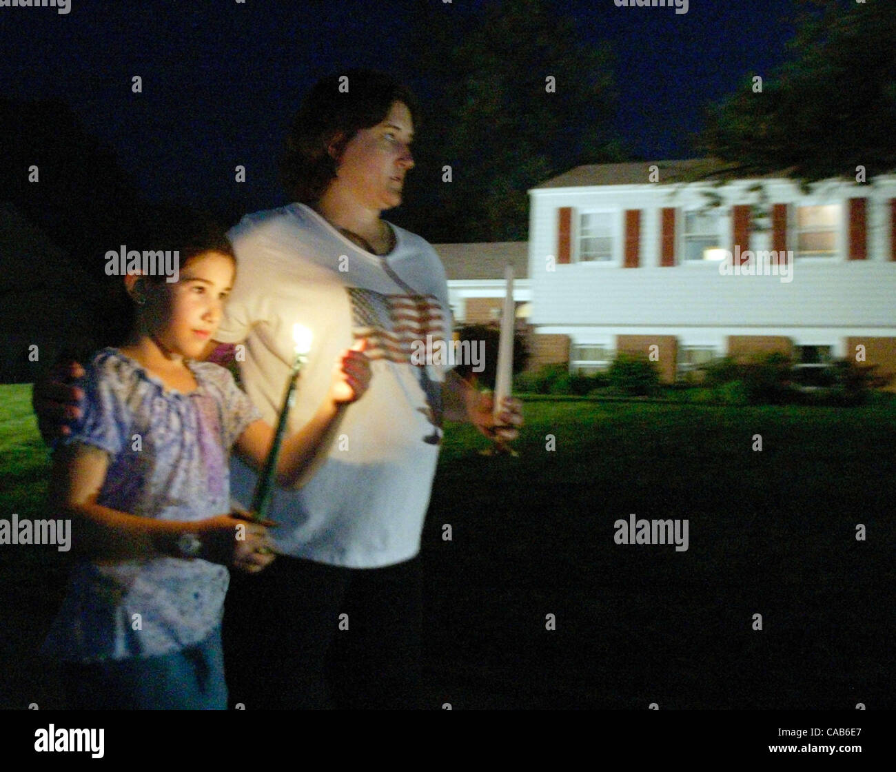 May 11, 2004; West Whiteland, PA, USA; Neighborhood residents walk by ...