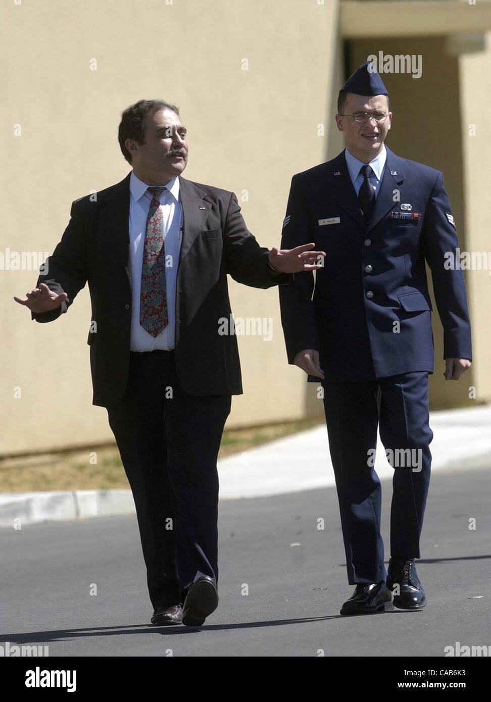 Senior Airman Ahmad I. Al Halabi, right, walks out of a court-martial ...