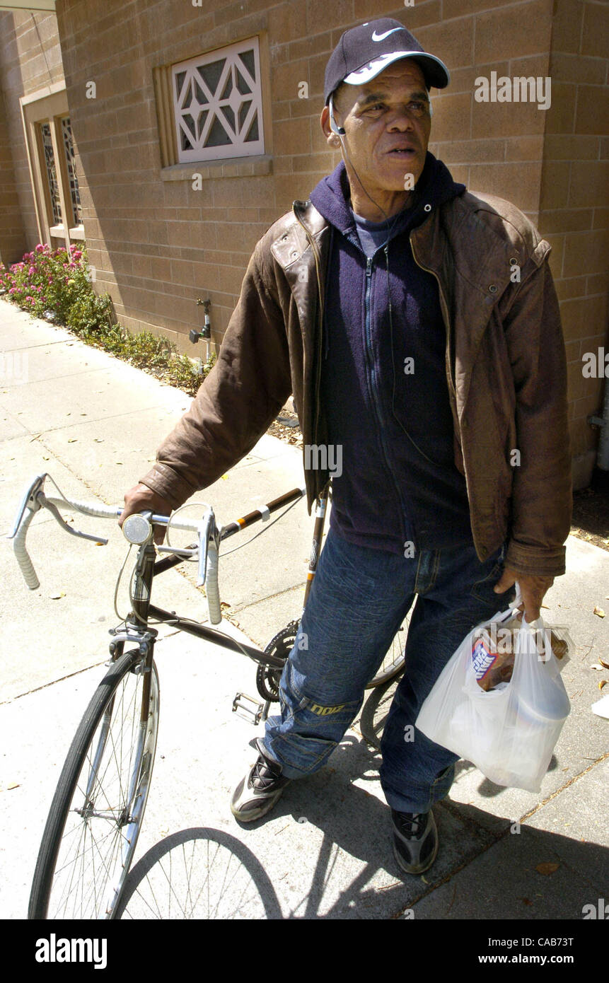 Ronald Stevens who is homeless, get on his bike after getting food from ...
