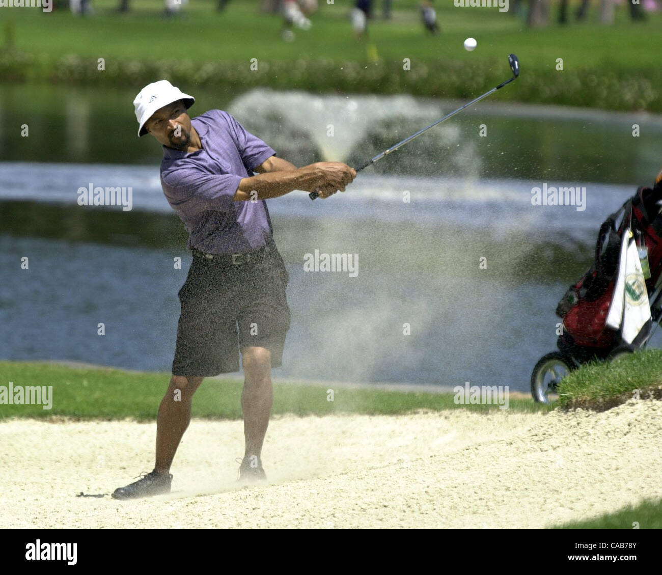 Gregory Isom, of Vallejo, successfully blasts out of a bunker and onto ...