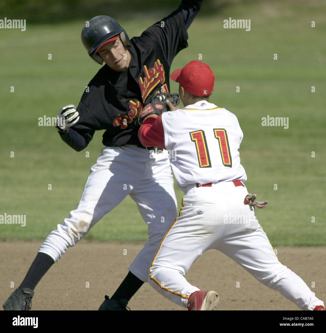 Erik Johnson, of Berkeley, gets tagged out by De Anza's Dwight Tanaka ...