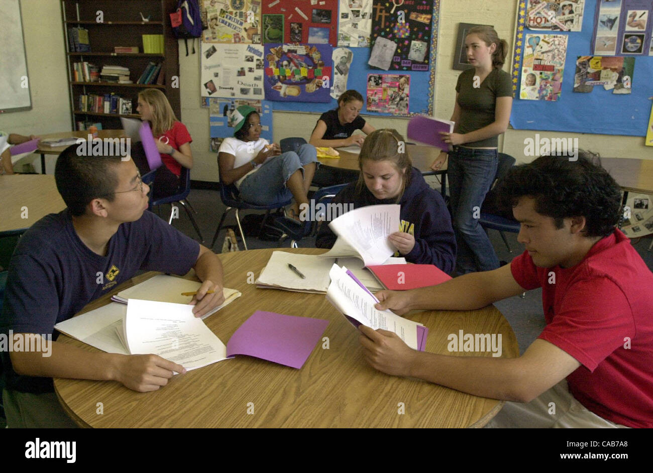 Jeff Dang, left, Julia Batavia, center, and Andrew Meyer, right, listen ...