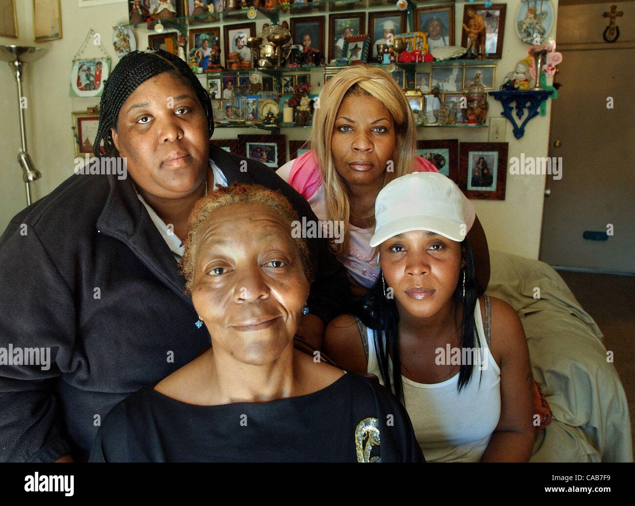 Glenda Neal, center, lost her son John Bolton Neal a year ago--he was ...