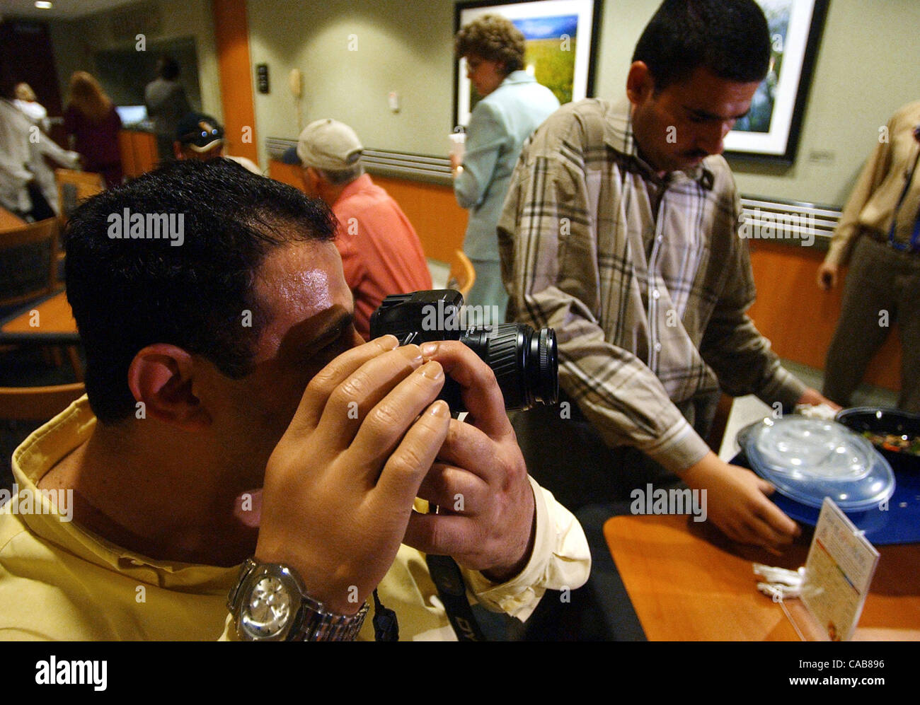 METRO - Hasan Al Gareawy takes a picture with his new prosthetic hand ...
