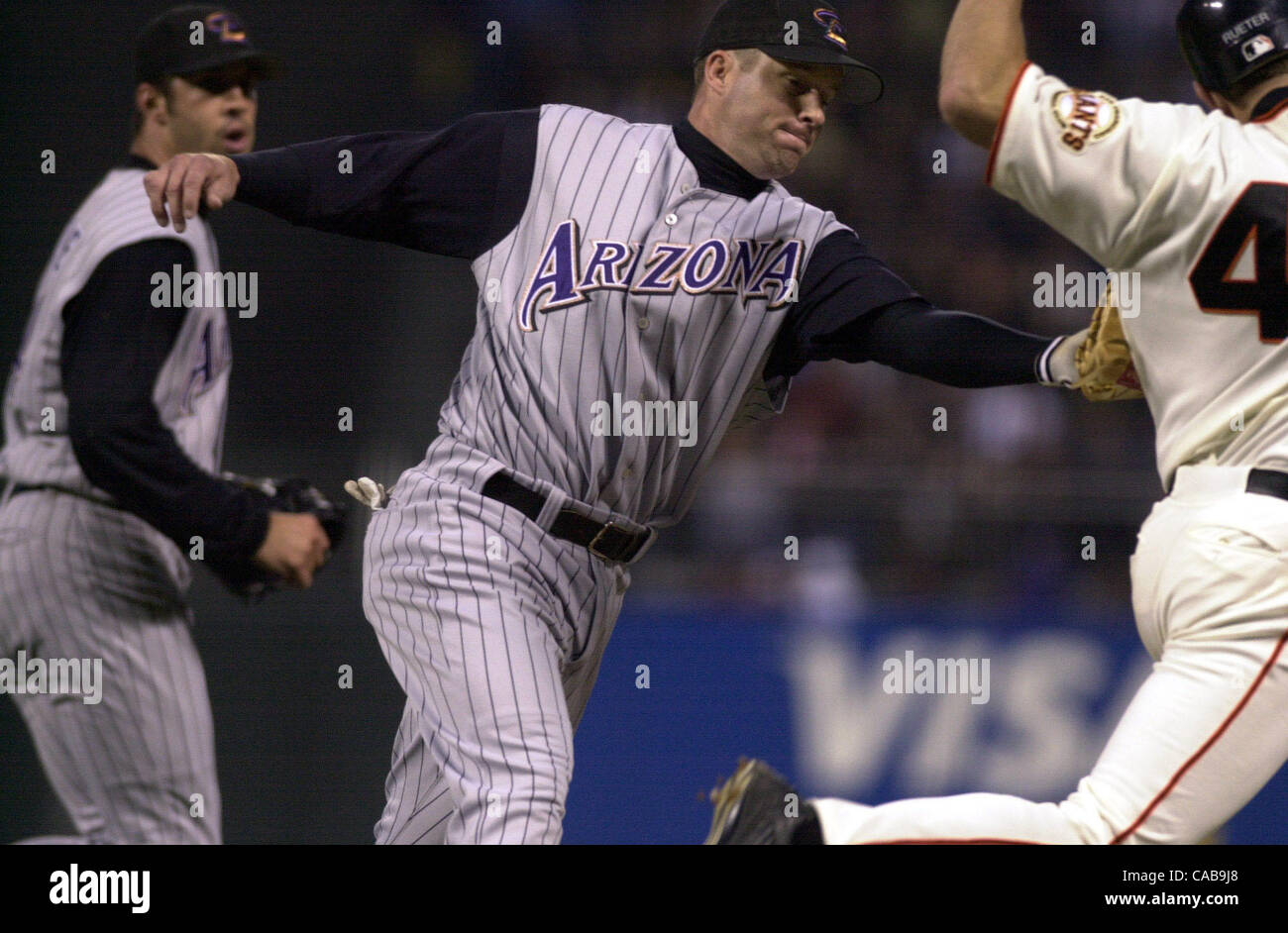 Arizona first baseman Shea Hillenbrand lunges to tag out Giants pitcher ...