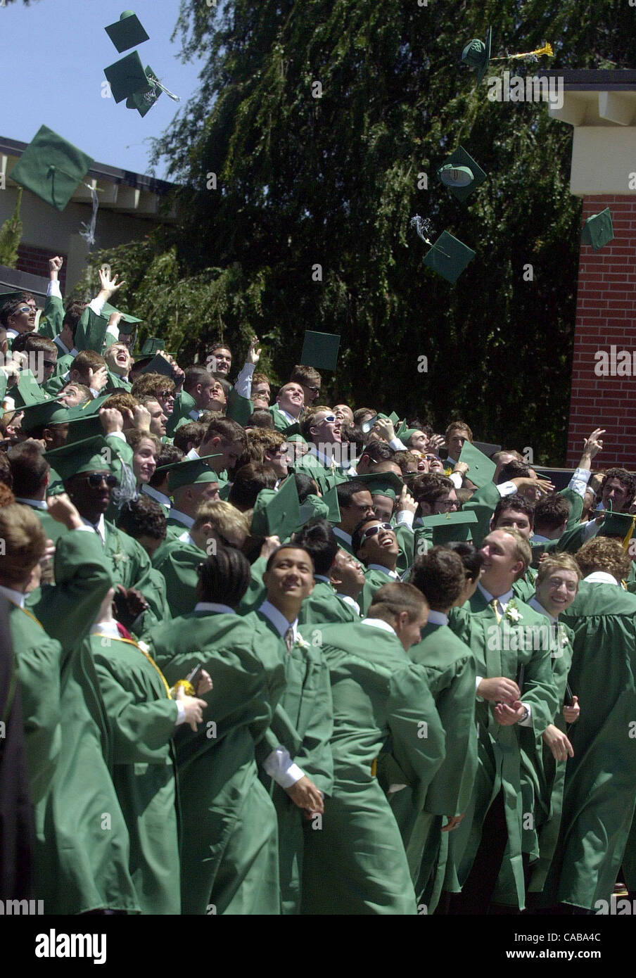 De La Salle High School graduates toss their caps during the graduation ...