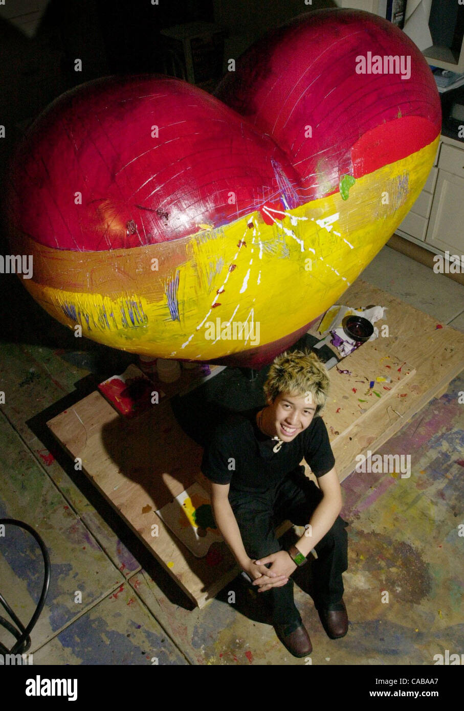 Teen artist Alan Chin (cq), 16, sits in front of his 400 pound ...