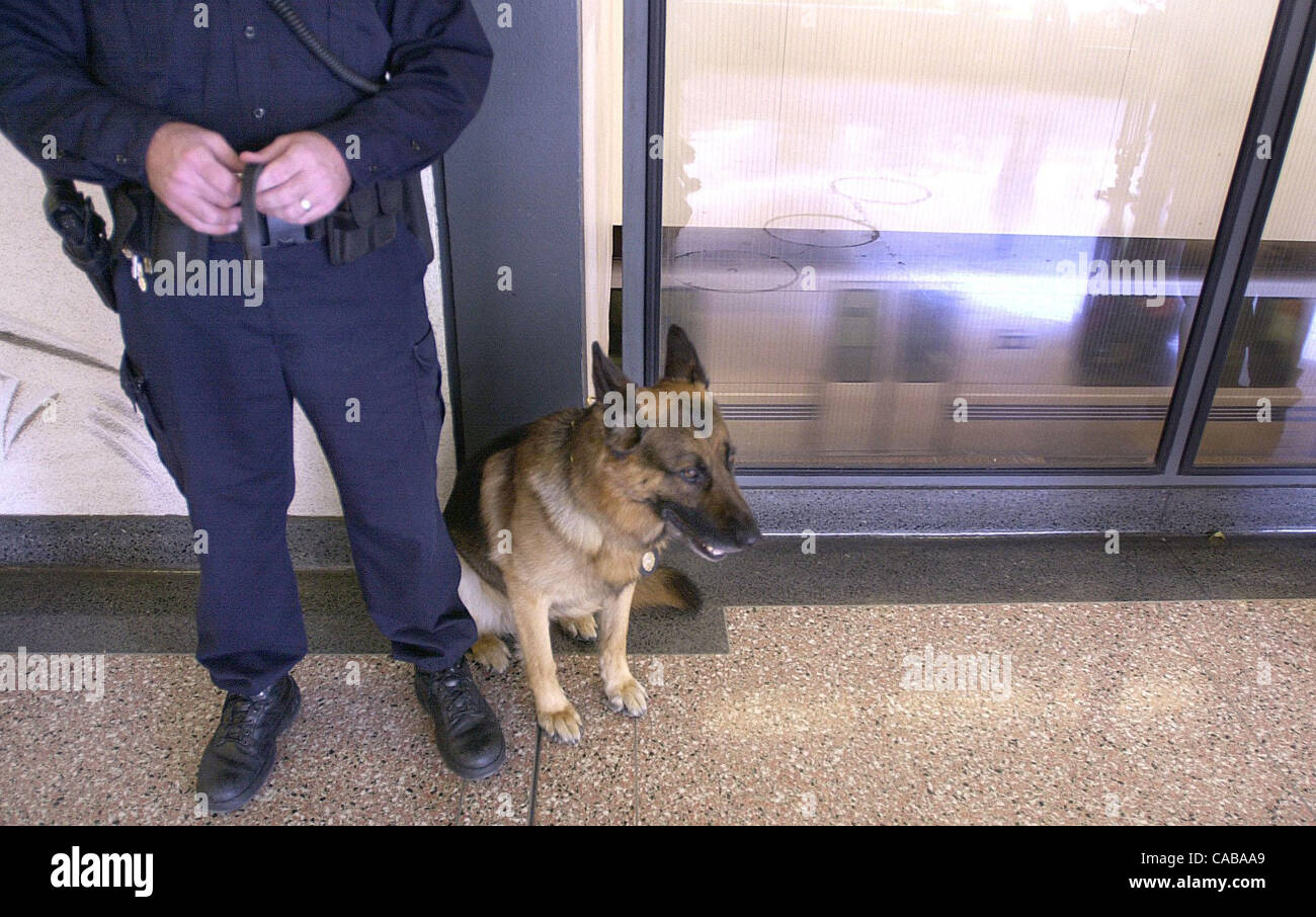 BART police officer Tom Smith (cq) and his patrol dog Boris patrol the ...