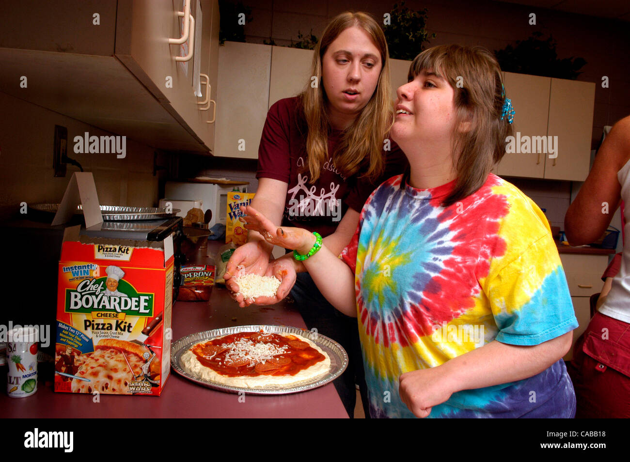 Jun 02, 2004; Woodstock, GA, USA; Special Ed teacher shows autistic ...