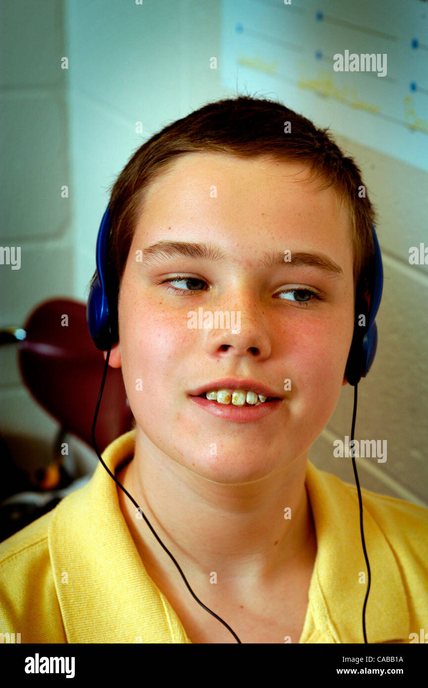 Jun 02, 2004; Woodstock, GA, USA; Autistic boy listens to music on a ...