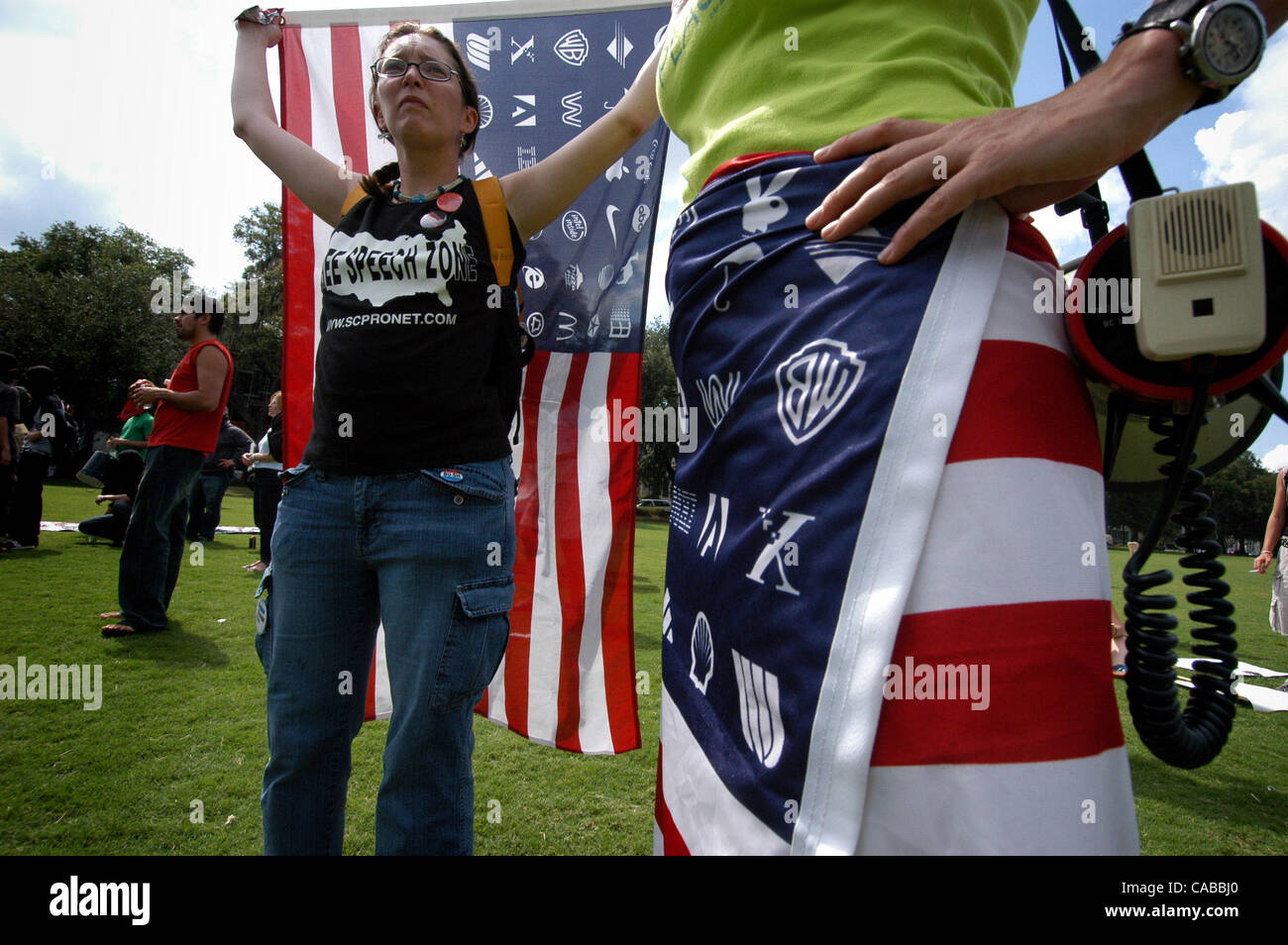 protesters at G8 summit wear U.S. flags modified with symbols of ...