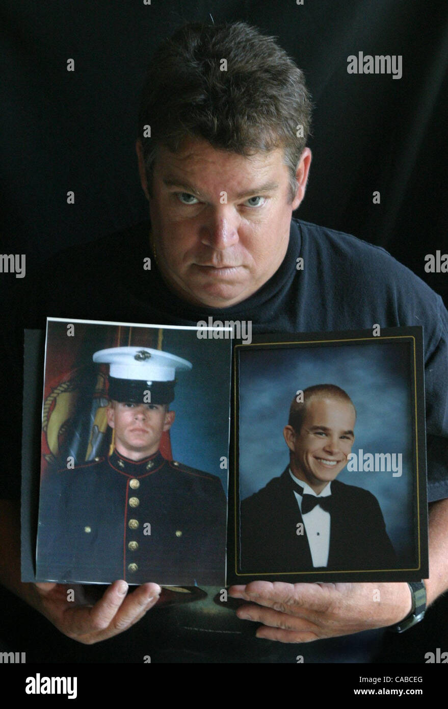 Mark Crowley (cq), father of Kyle Crowley (cq), poses with photos of his son at his home in San ...