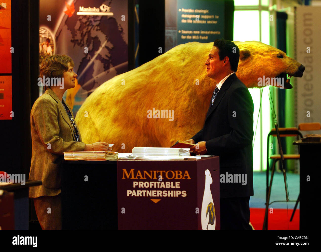 Eleanor Toews uses a stuffed polar bear to lure people into her booth ...