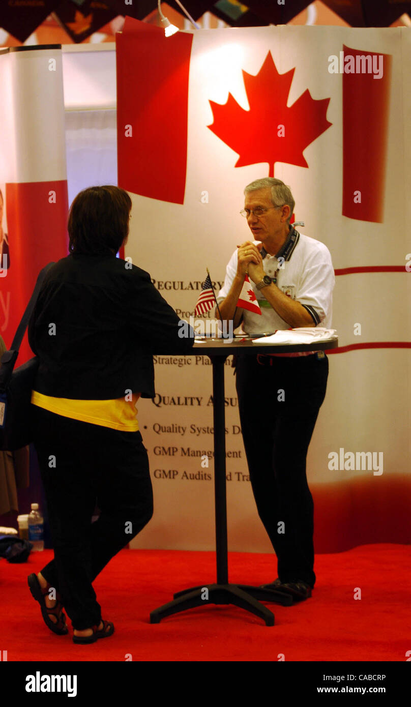 Dave McCarthy uses his booth at the Bio 2004 Convention in San ...