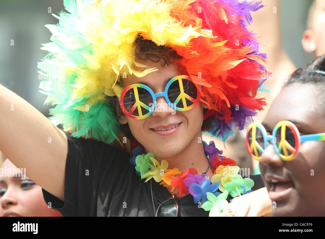 New Yorkers Celebrating The Gay Pride Parade Along Fifth Ave In