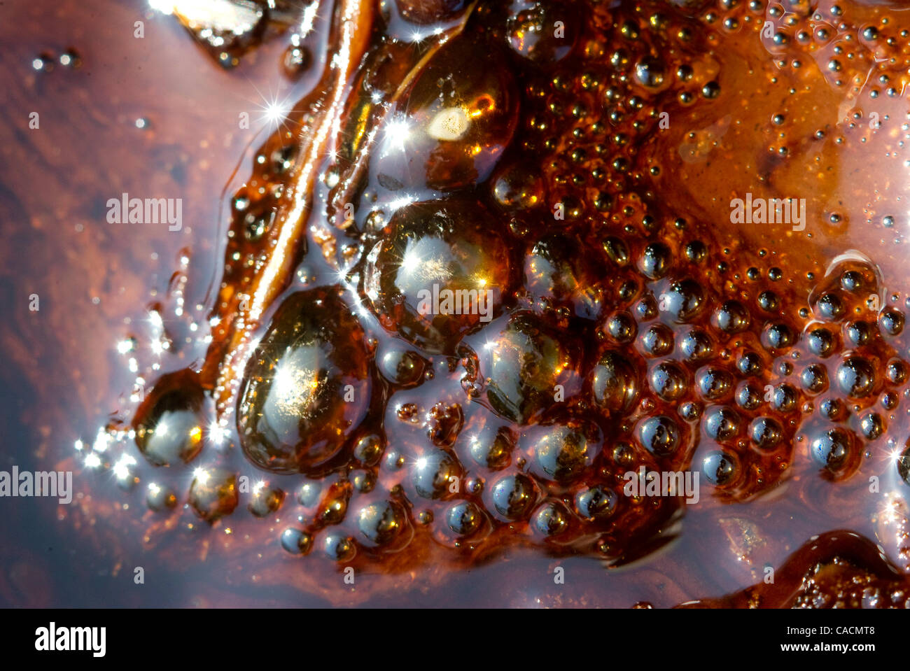 Puddle of oil hi-res stock photography and images - Alamy