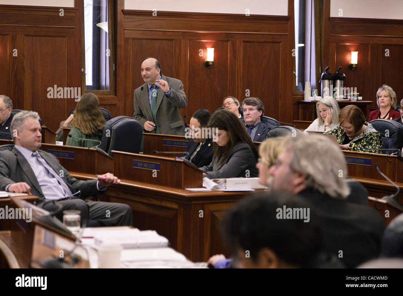 Rep. Les Gara (D) (standing) speaks to the Alaska House of ...