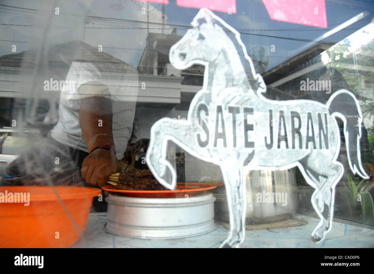 A food seller grill horse meat satay in Yogyakarta, Java Island ...