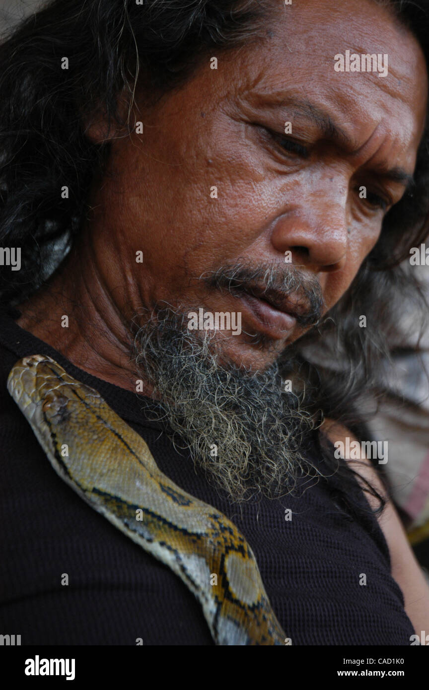 An animal handler, BIDUT plays with his favorite Python in Jakarta ...