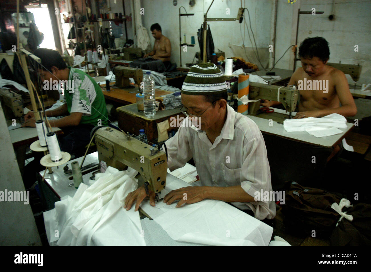 Workers sew clothes at Garment home industry factory in Jakarta ...