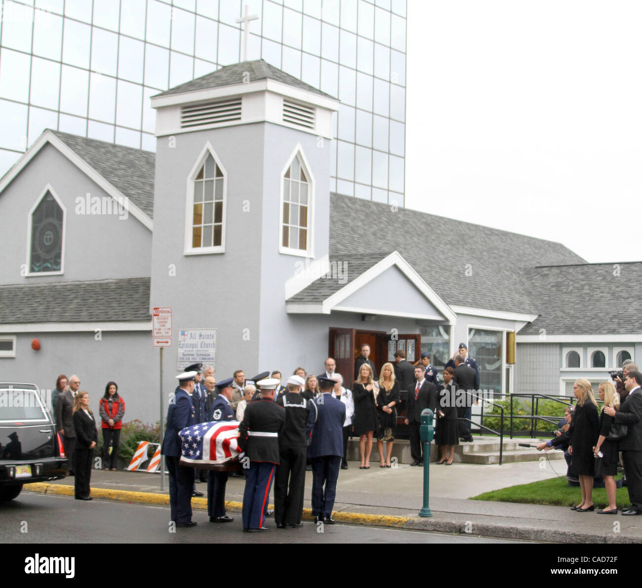 An honor guard carries the casket of former Alaska U.S. Senator Ted ...