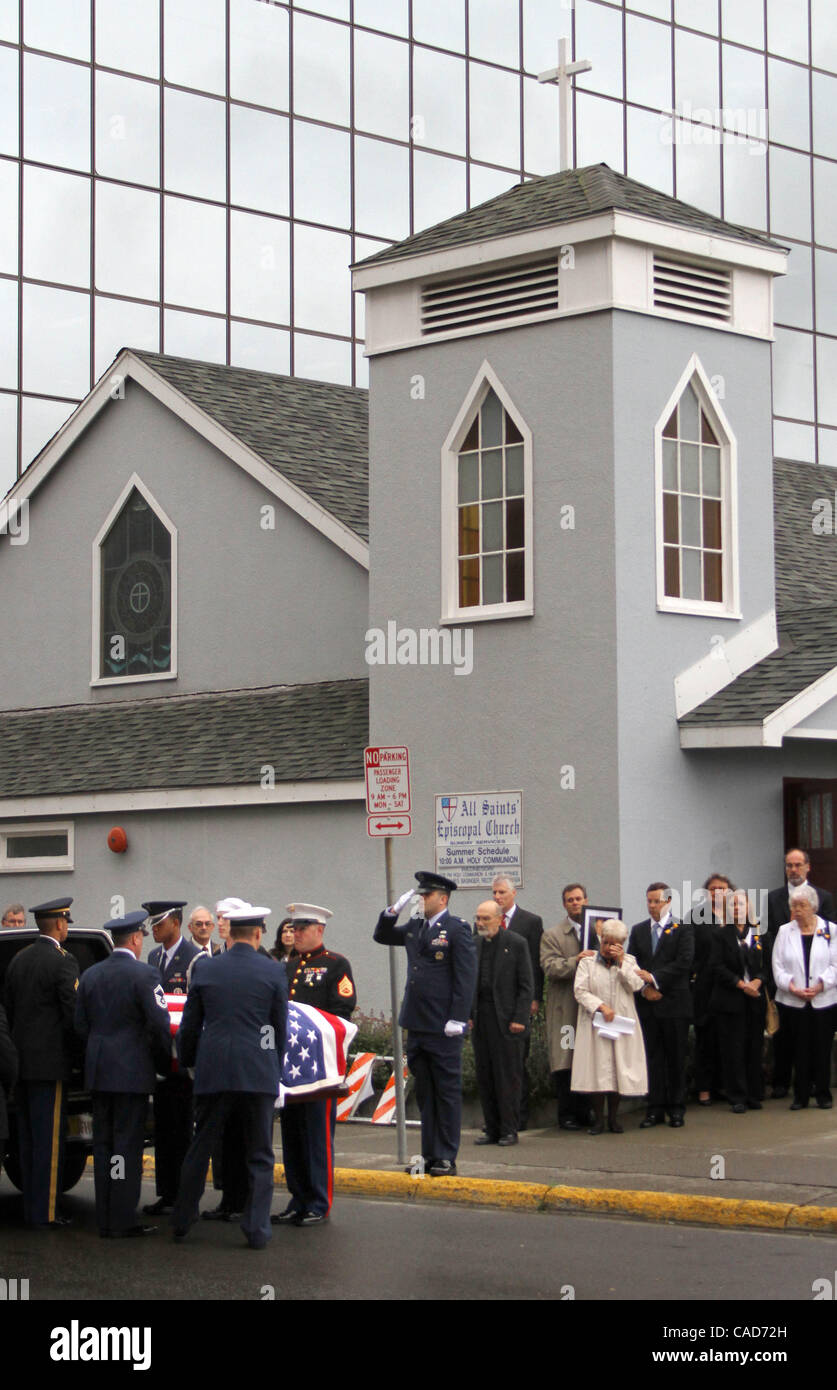 An honor guard carries the casket of former Alaska U.S. Senator Ted ...
