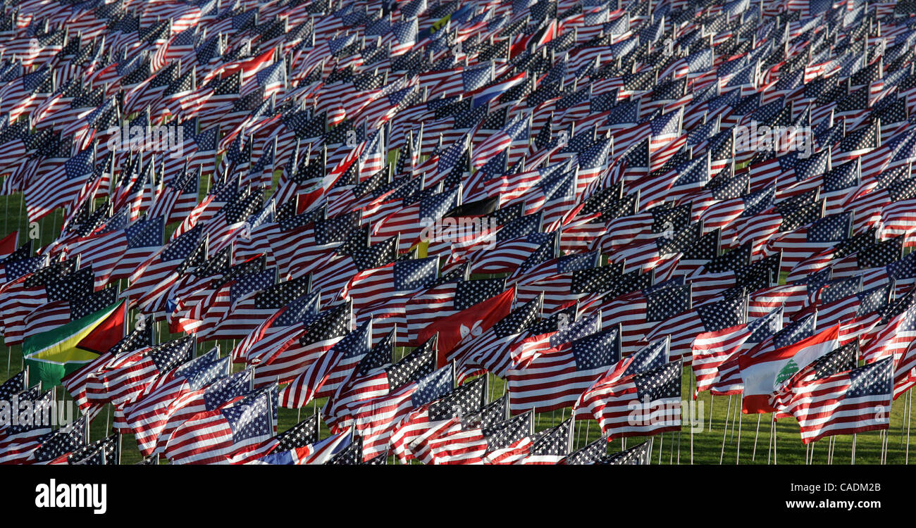 Staff and students erect nearly 3,000 US flags to honor the victims of ...