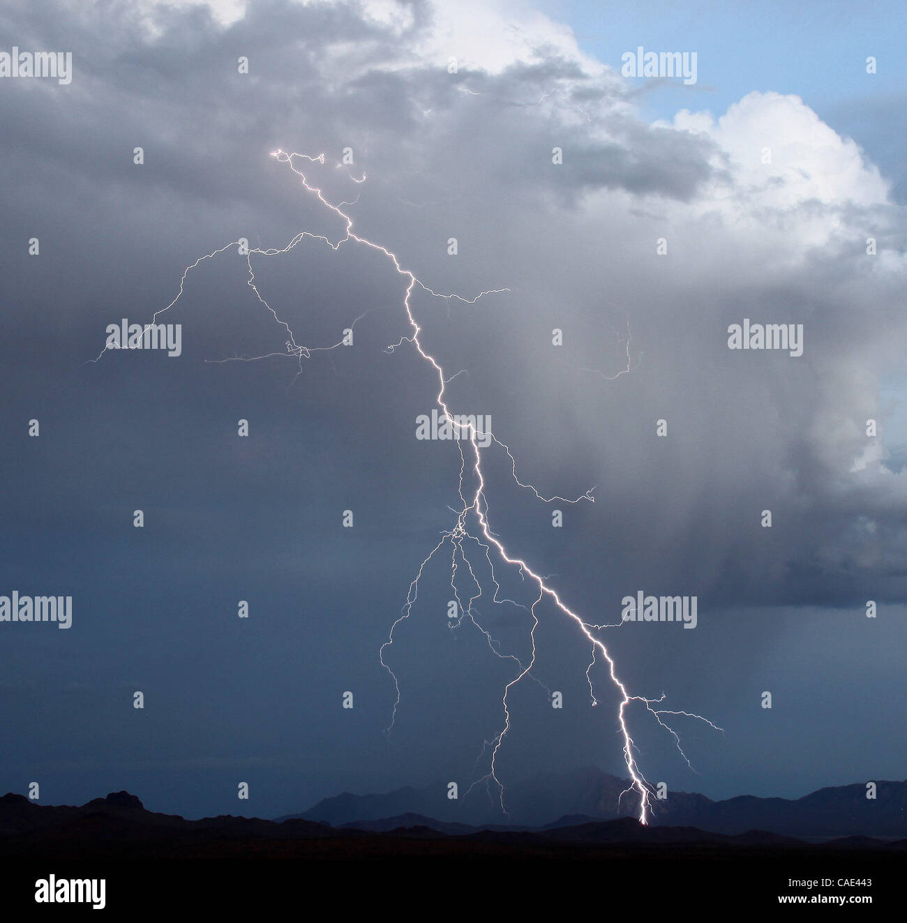 Aug 17-18 -Searchlight, Nevada, USA. Monsoon clouds cross over the town ...