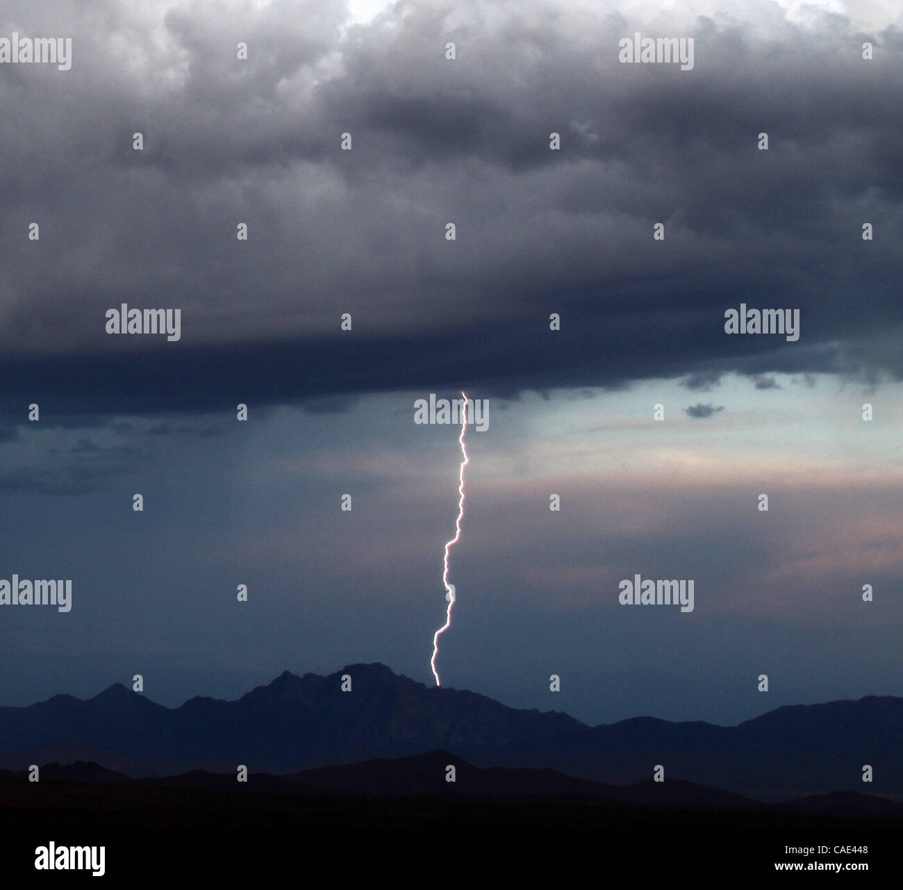 Aug 17-18 -Searchlight, Nevada, USA. Monsoon clouds cross over the town ...