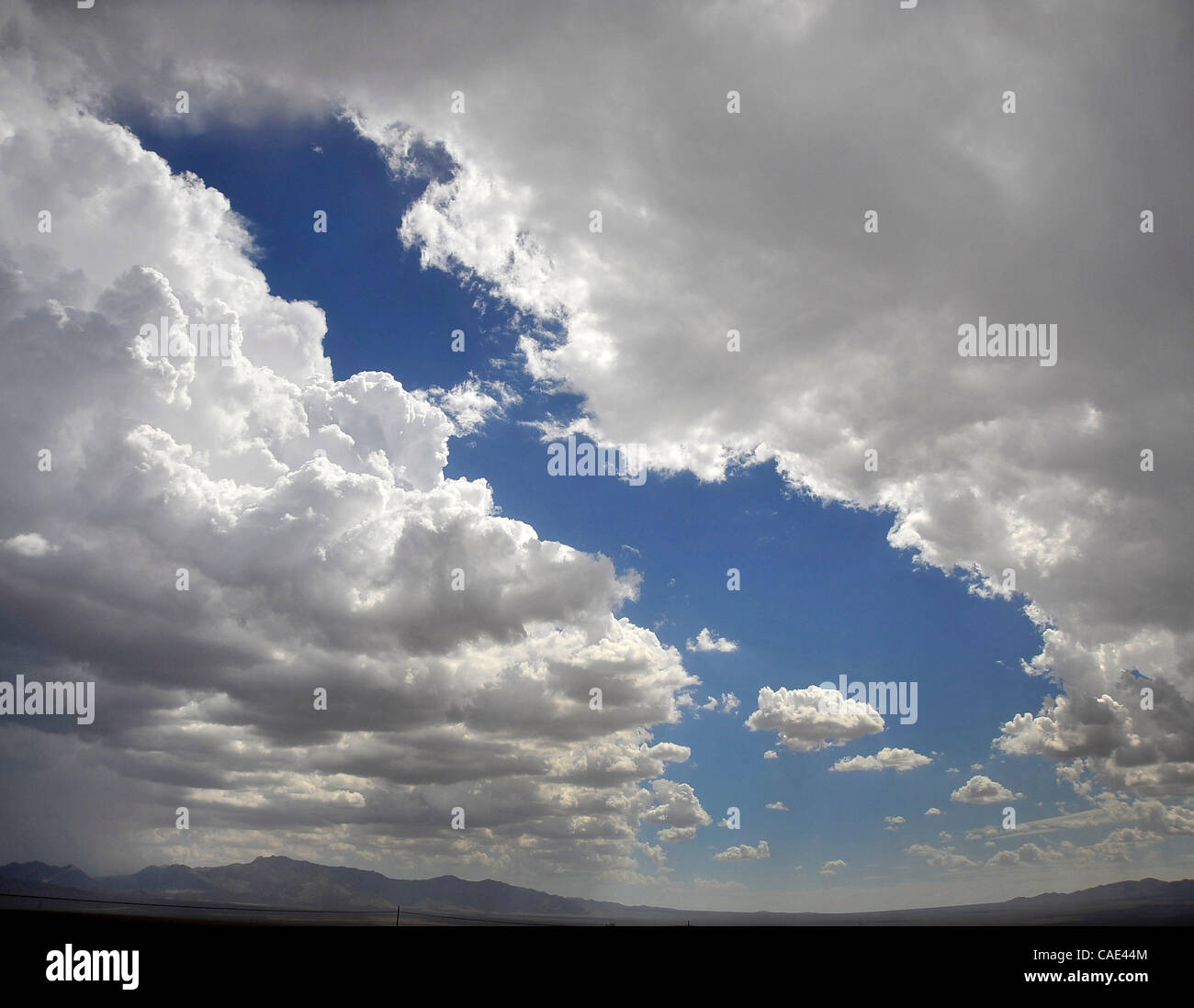 Aug 17-18 -Searchlight, Nevada, USA. Monsoon clouds cross over the town ...